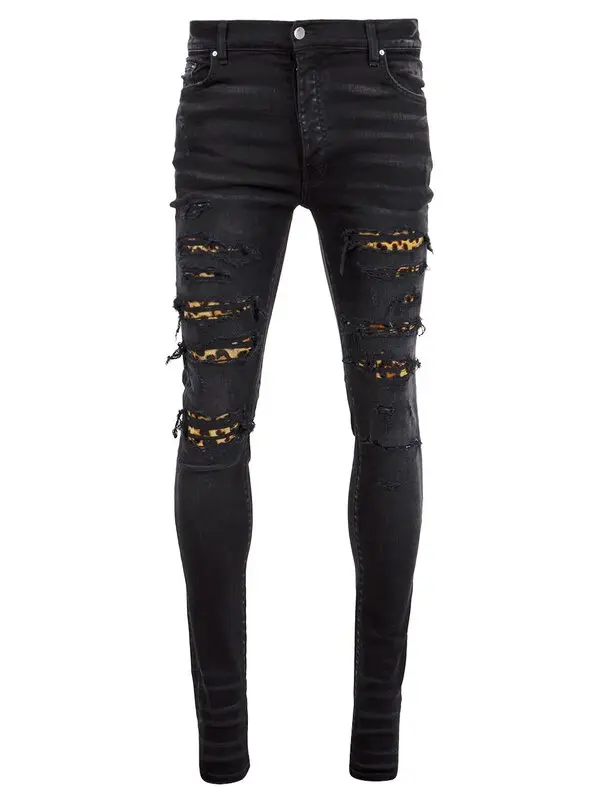 Amiri Distressed Leopard Thrasher Jean Aged - Black | Editorialist