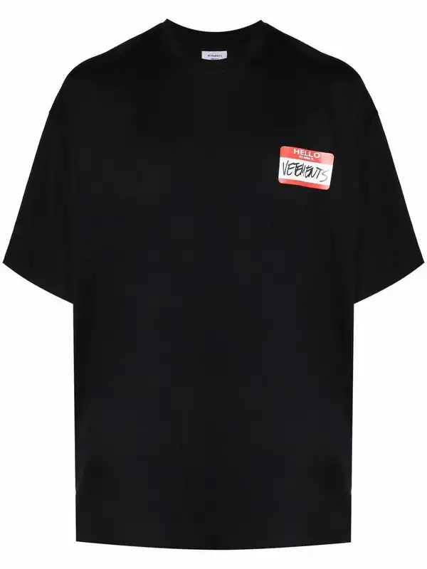 Vetements Nae Tag-Print Cotton T-Shirt - Black | Editorialist