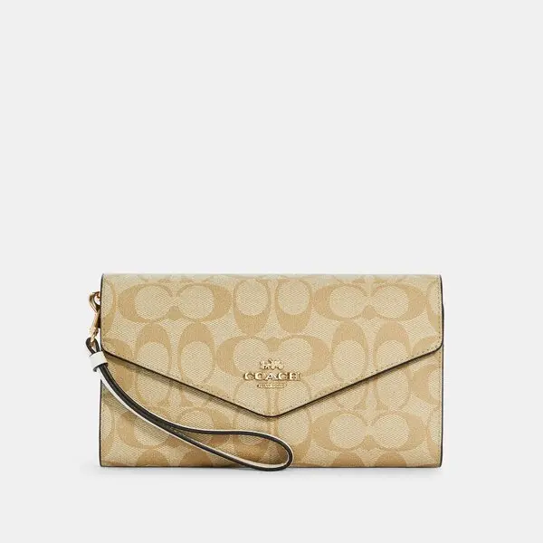 Buy COACH OUTLET Coach Travel Envelope Wallet In Signature Canvas ...
