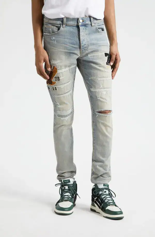 Amiri Varsity Eagle Logo Ripped Skinny Jeans - Antique Indigo ...