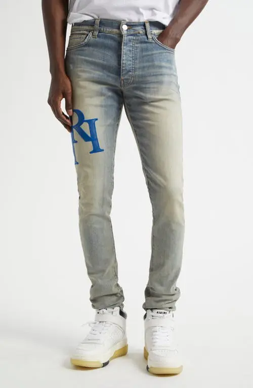 Amiri Staggered Logo Skinny Jeans - Antique Indigo Blue