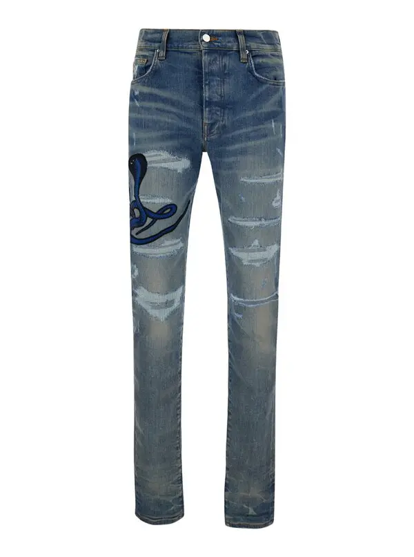 Amiri Light Skinny Jeans With Rips And Snake Patch In Stretch