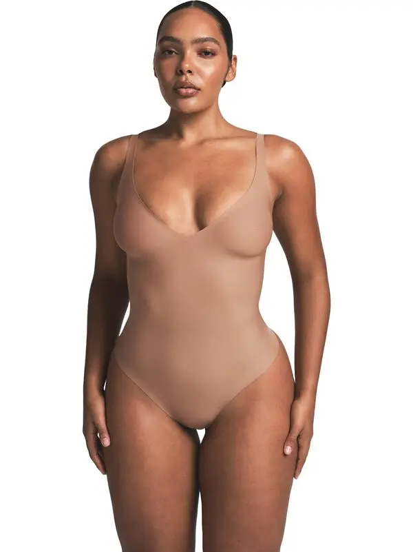 SKIMS Body Unlined Plunge Thong Bodysuit - Sienna