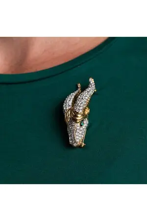 KENNETH JAY LANE Rhinestone And Emerald Capricorn Pin - Natural
