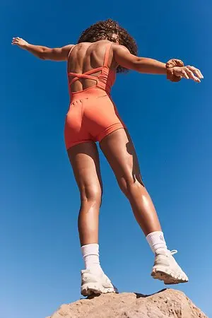 Free People FP Movement Good Karma Runsie Orange