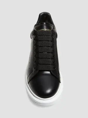 Alexander McQueen S Oversized Embossed Logo Leather Sneakers - Black