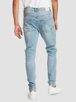 PURPLE BRAND P002 Repair Drop-fit Skinny Jeans