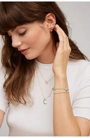 Estée Lauder Engraved Pendant Necklace