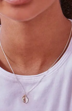 Estée Lauder Wing Pendant Necklace