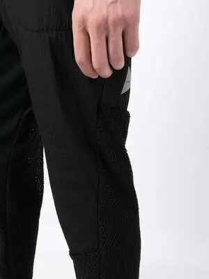AND WANDER Fleece-panel Trousers