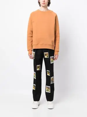 DENIM TEARS Polaroid Print Trousers