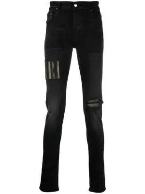 Amiri Logo-appliqué Distressed Jeans