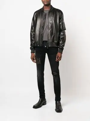 Amiri Logo-appliqué Distressed Jeans
