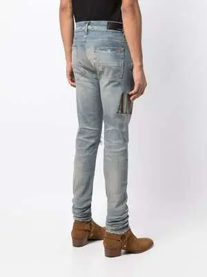 Amiri Logo-embroidered Ripped-detail Jeans