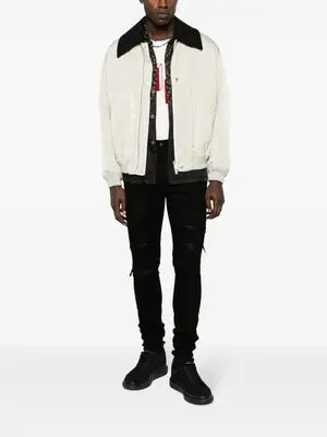 Amiri Logo-patch Ripped Skinny Jeans - Black
