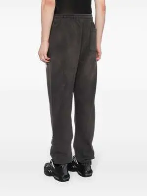 SAINT MXXXXXX Slogan-print Cotton Track Pants