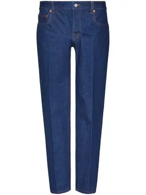 Valentino Garavani Logo-appliqué Tapered-leg Jeans - Blue