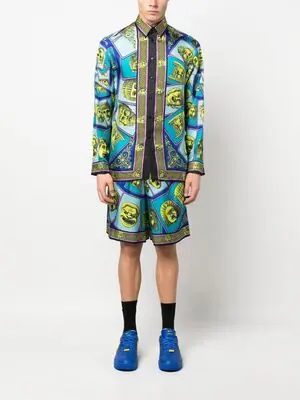 Versace Le Maschere Print Silk Shorts - Blue