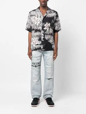 Amiri Logo-embroidered Ripped Jeans
