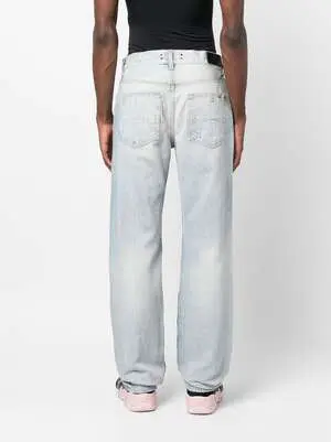 Amiri Logo-embroidered Ripped Jeans