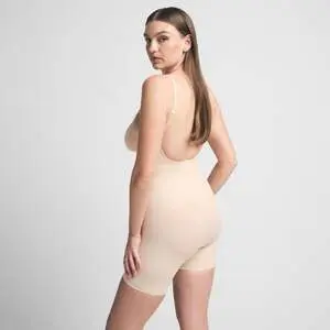 SKIMS Seamless Sculpt Low Back Mid Thigh Bodysuit - Sand