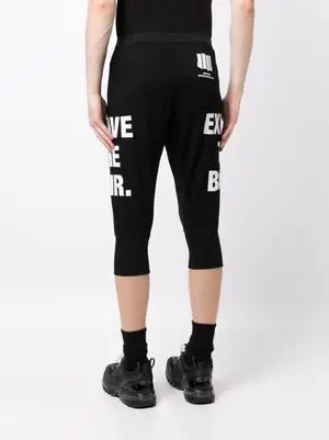 NILØS Slogan-print Drop-crotch Shorts