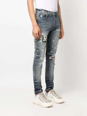 Amiri Varsity Ripped Skinny Jeans