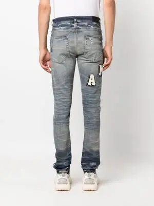 Amiri Varsity Ripped Skinny Jeans