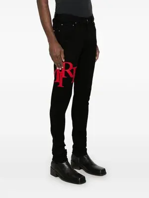 Amiri Staggered-logo Jeans
