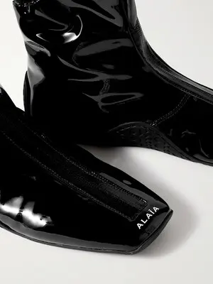 Alaïa Glossed Ankle Boots