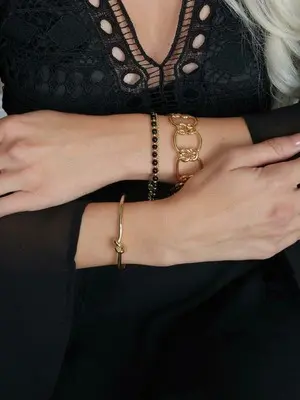 DLORIA Plated Love Knot Cuff Bracelet
