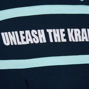 Mitchell & Ness Deep Sea Blue Seattle Kraken Head Coach Slogan Pullover Hoodie