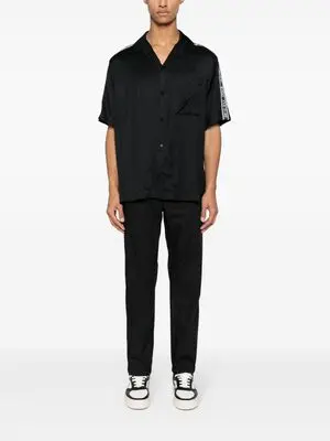 Versace Tapered-leg Trousers With Logo Strap