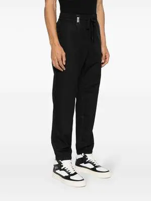 Versace Tapered-leg Trousers With Logo Strap