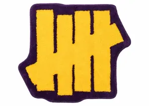 UNDEFEATED Icon Bath Mat - Purple/gold