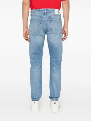 Calvin Klein Distressed Tapered-leg Jeans