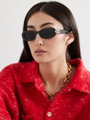 Miu Miu Oval Sunglasses