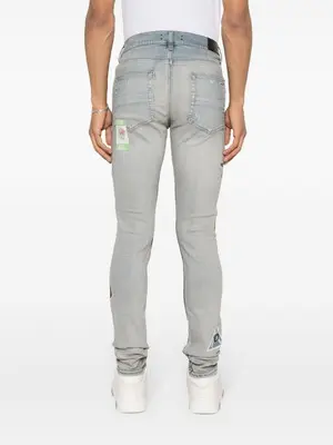 Amiri Travel Patch Repair Skinny Jeans
