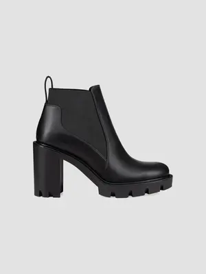 CHRISTIAN LOUBOUTIN Marchacroche Lug Booties - Black