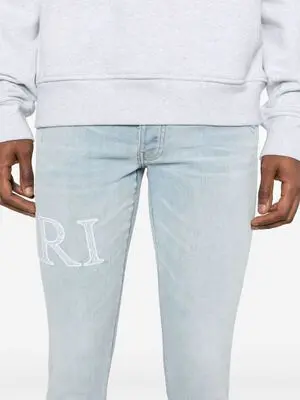 Amiri Bandana-jacquard Logo Appliqué Jeans