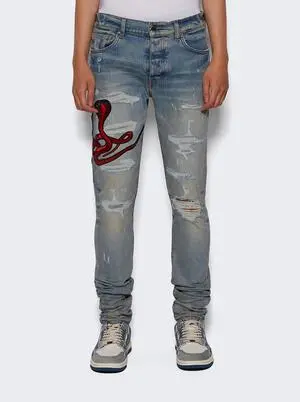 Amiri Red Snake Archival Skinny Jeans In Clay Indigo 40% Off