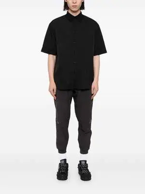 AND WANDER Water-repellent Tapered Trousers