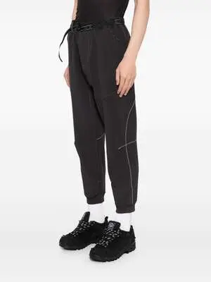 AND WANDER Water-repellent Tapered Trousers