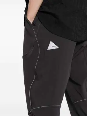 AND WANDER Water-repellent Tapered Trousers