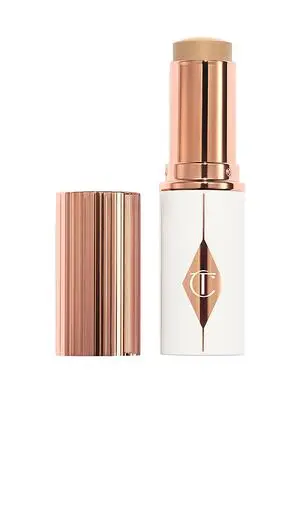 Charlotte Tilbury Charlotte Tilbury Unreal Skin Sheer Glow Tint Hydrating Foundation Stick In 5 Medium. 5 Medium