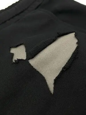 MOSTLY HEARD RARELY SEEN Ripped-up Cotton Sweatpants - Black