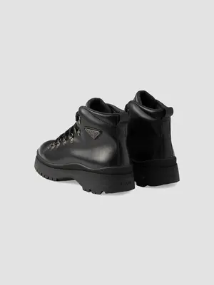 Prada Brixxen Leather Booties - Black