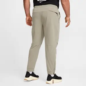 Nike Unlimited Dri-fit Zippered Cuff Versatile Pants - Green