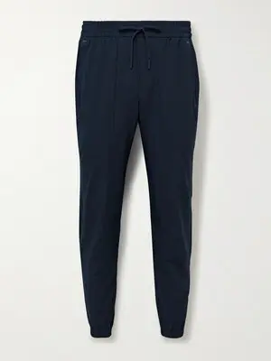 Lululemon License To Train Slim-fit Tapered Stretch Recycled-shell Track Pants - Blue