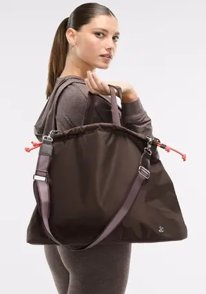 PELOTON Cinch Sack Crossbody Bag - Cocoa